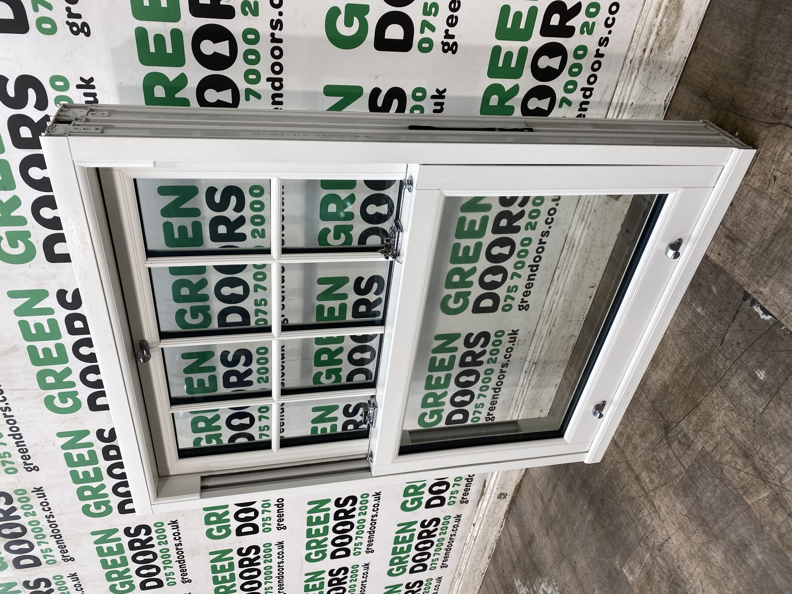White uPVC Box sash window | Green doors