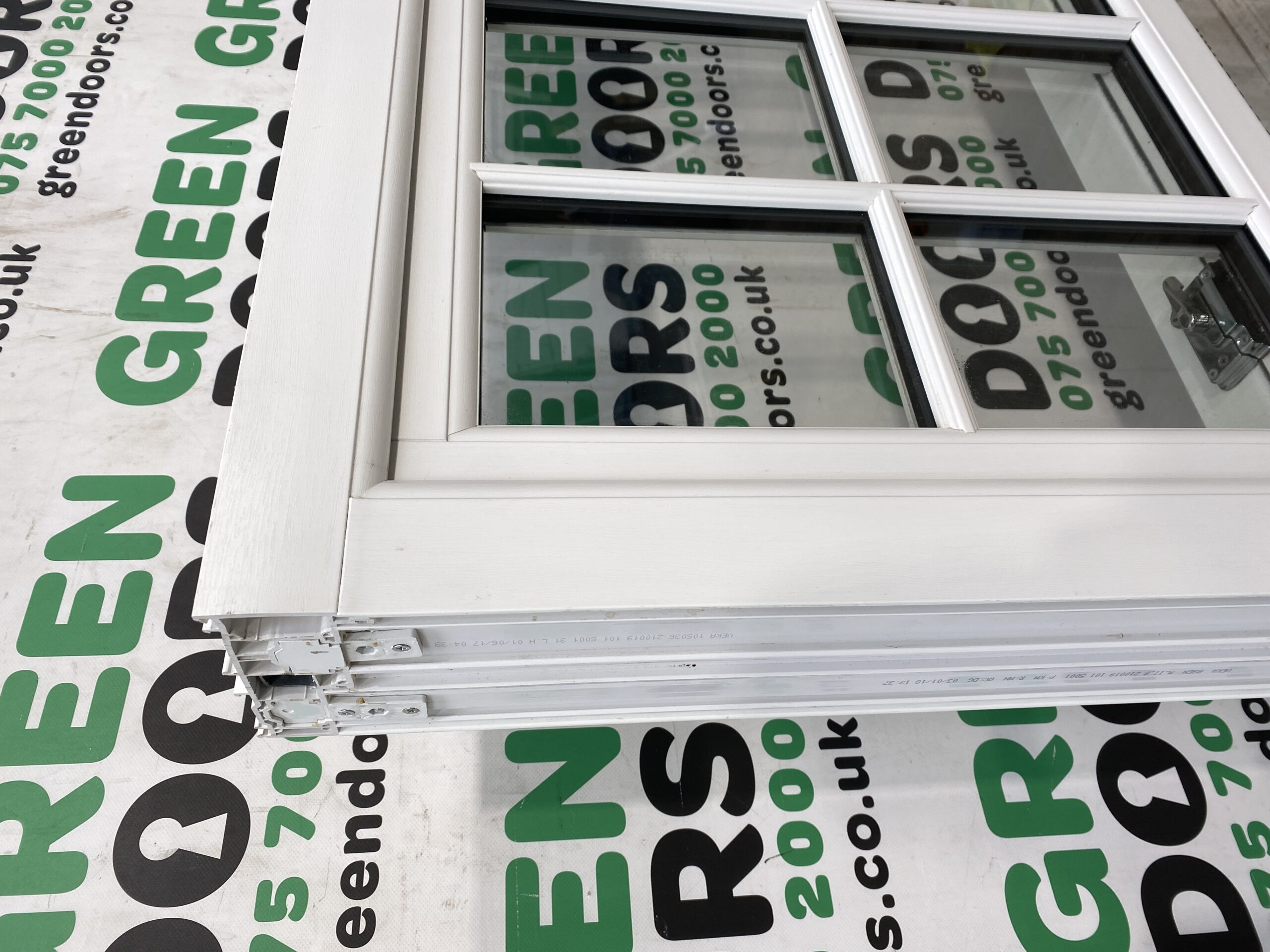 White uPVC Box sash window | Green doors